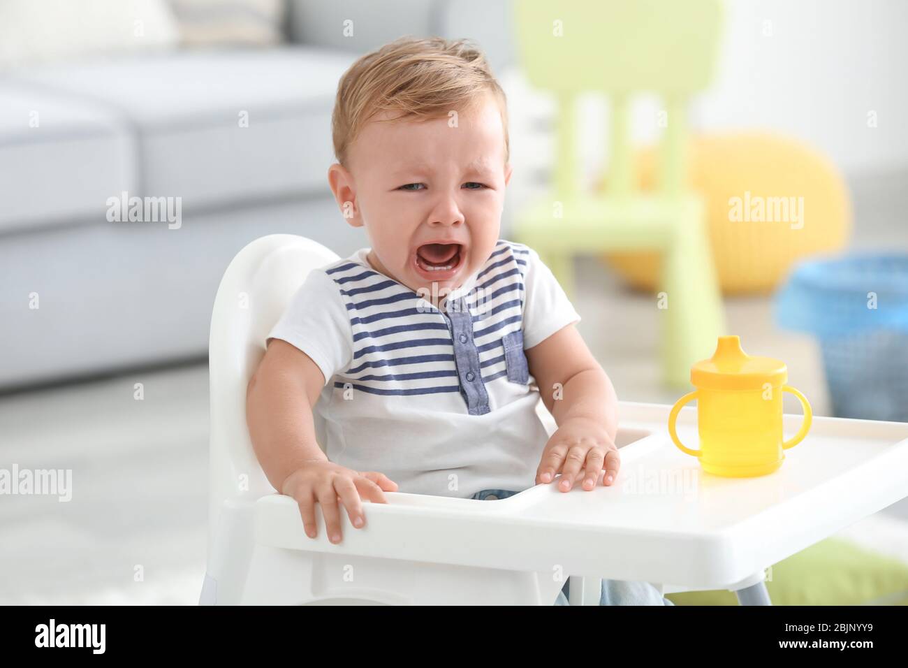Baby highchair crying hi-res stock photography and images - Alamy