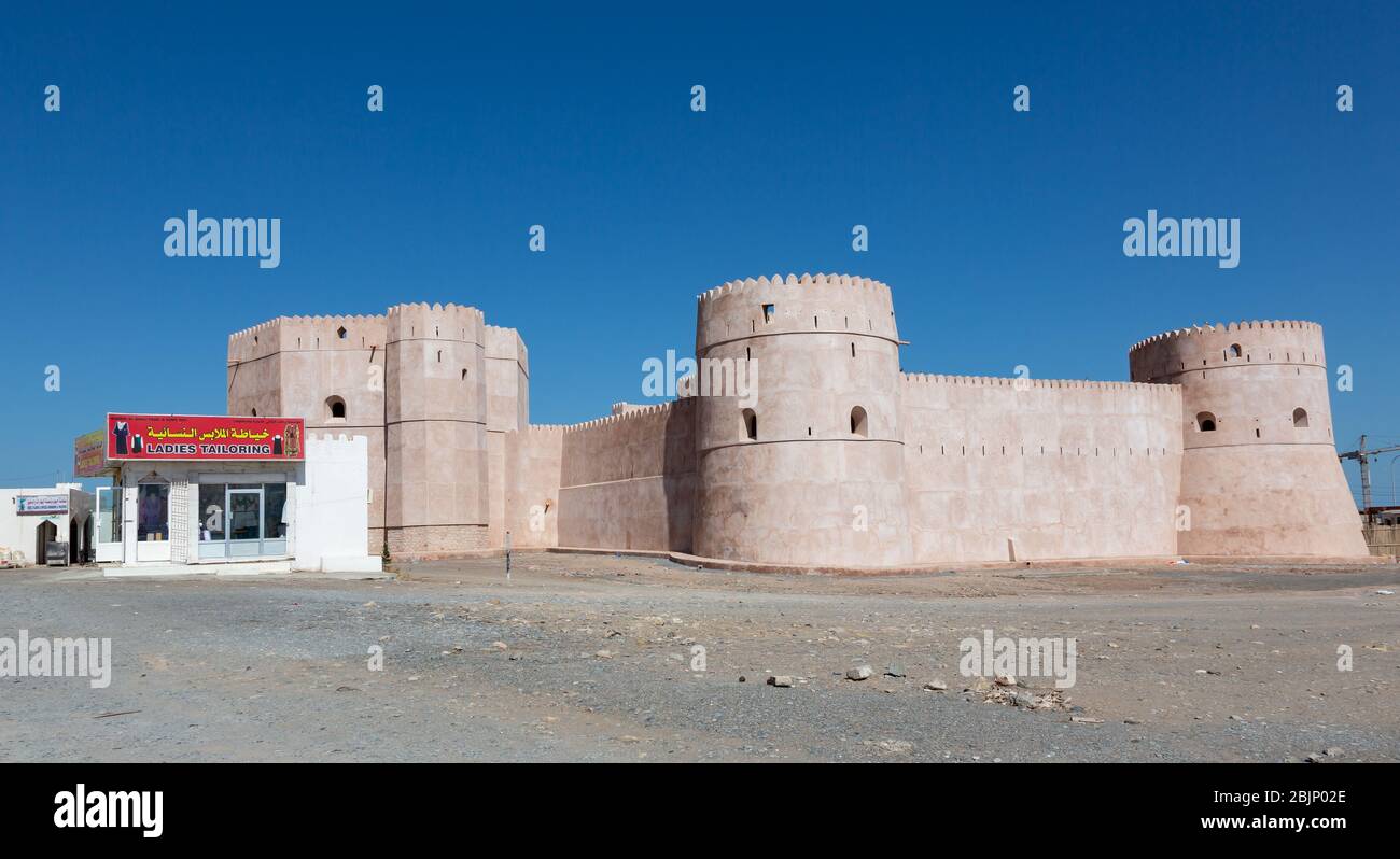 Fort in Barka, Oman, with Ladies Tailoring shop next to it Stock Photo ...