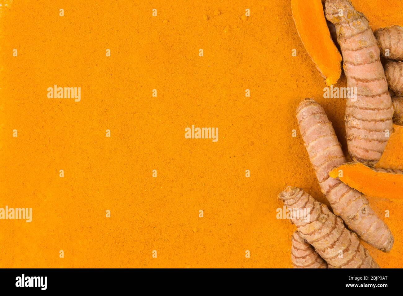 Curcumin root and turmeric spice background from above. Herbal medicine ...