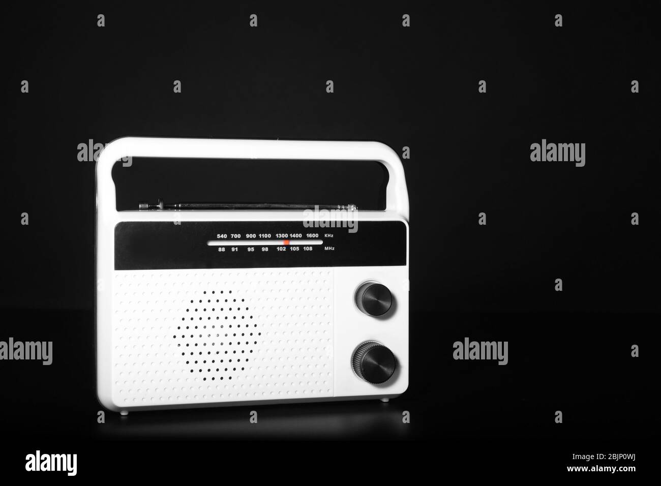 Retro radio on black background Stock Photo - Alamy