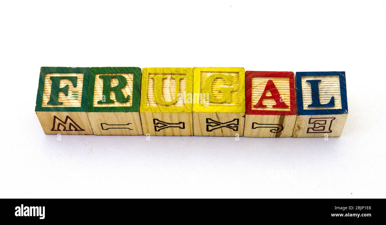 The term frugal displayed visually on a clear background using colorful ...