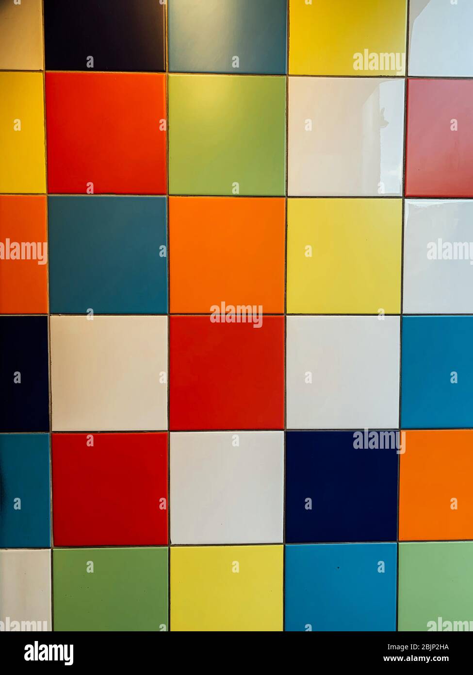multicolored tile squares on the wall a background Stock Photo - Alamy