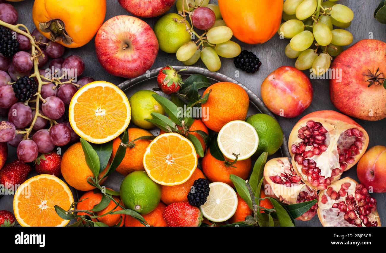 Assorted fruits. Different fruits on a gray background, the whole ...
