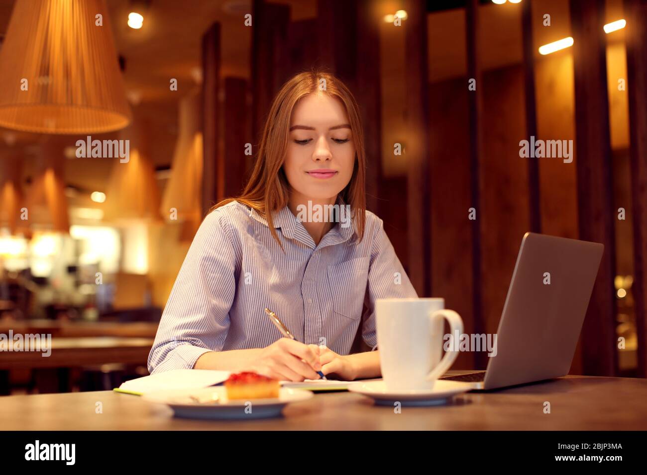 Young female marketing specialist working hi-res stock photography and ...