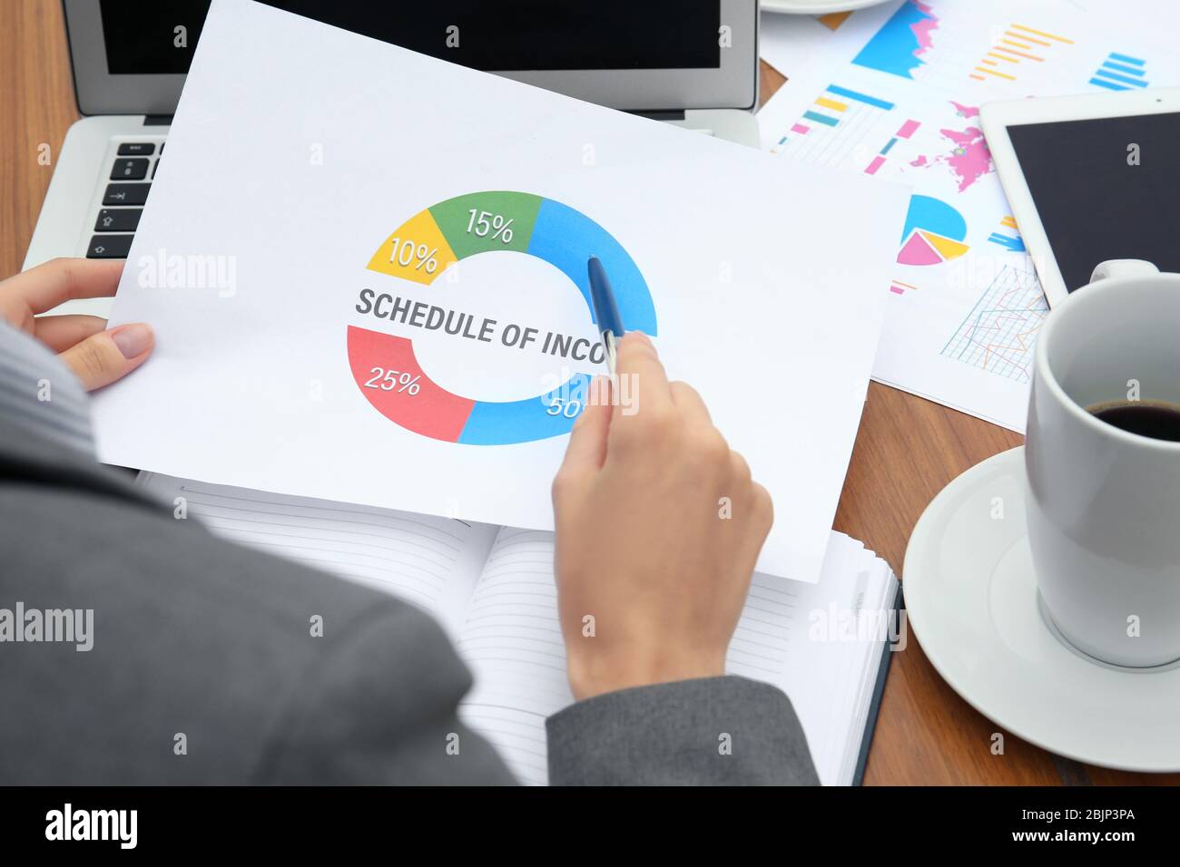 Young female marketing manager working with diagram Stock Photo - Alamy
