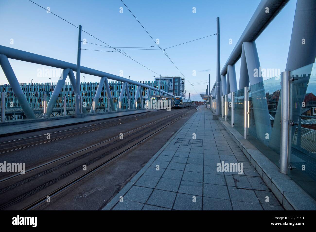 Train station tram stop at sunrise, Nottingham City South side captured ...