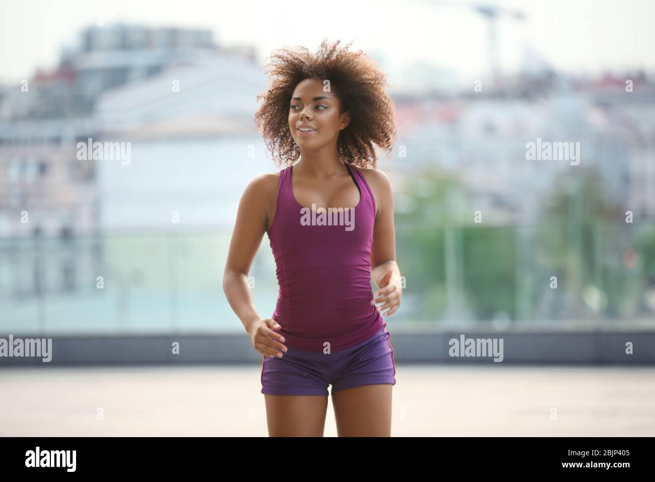 American woman running outdoors hi-res stock photography and images - Alamy