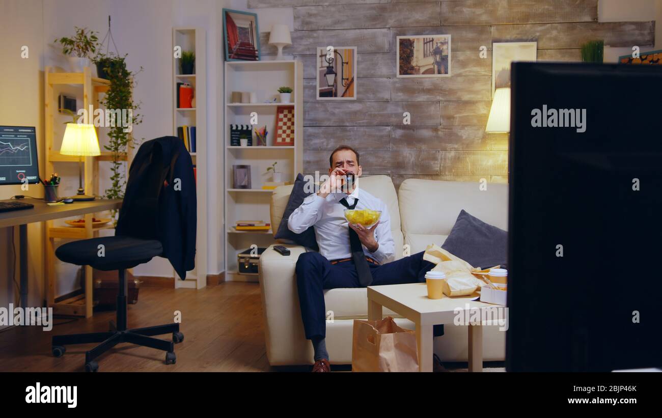 Funny man eating chips hi-res stock photography and images - Alamy