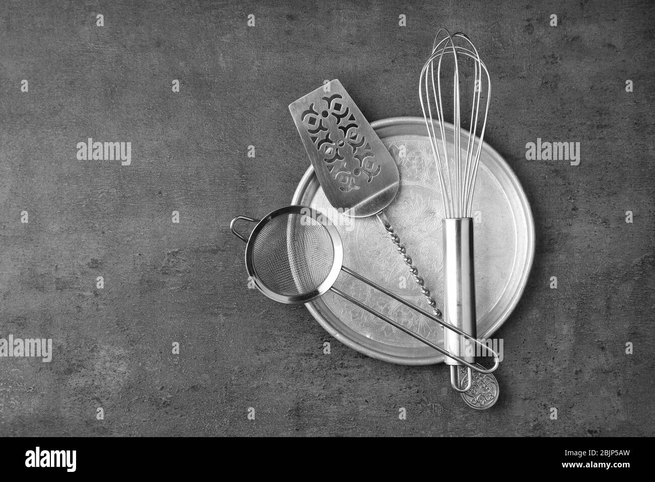 Various kitchen utensils on grey textured background Stock Photo - Alamy