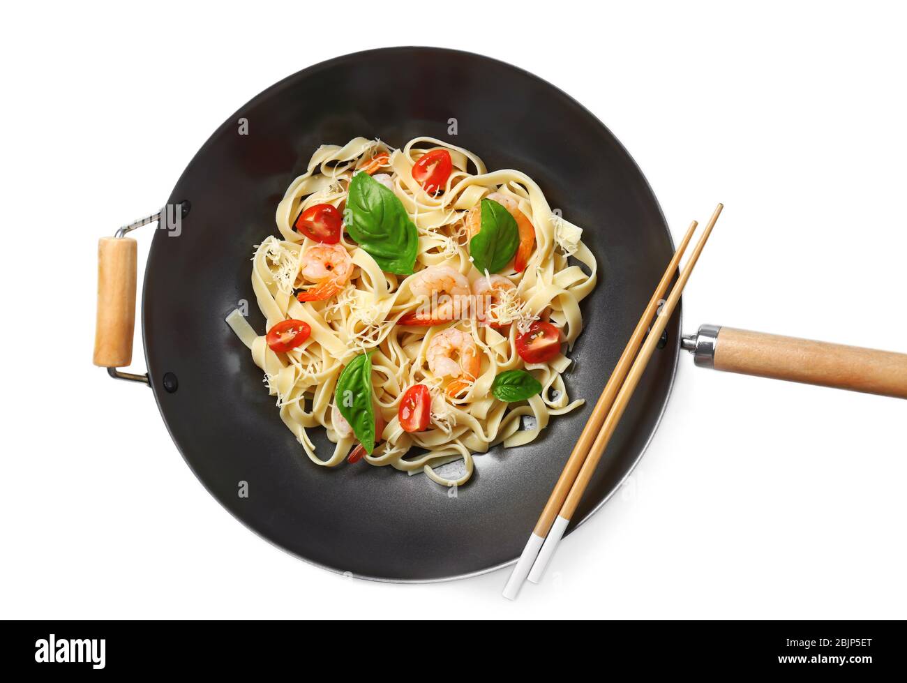 Wok with tasty pasta and shrimps on white background, top view Stock ...
