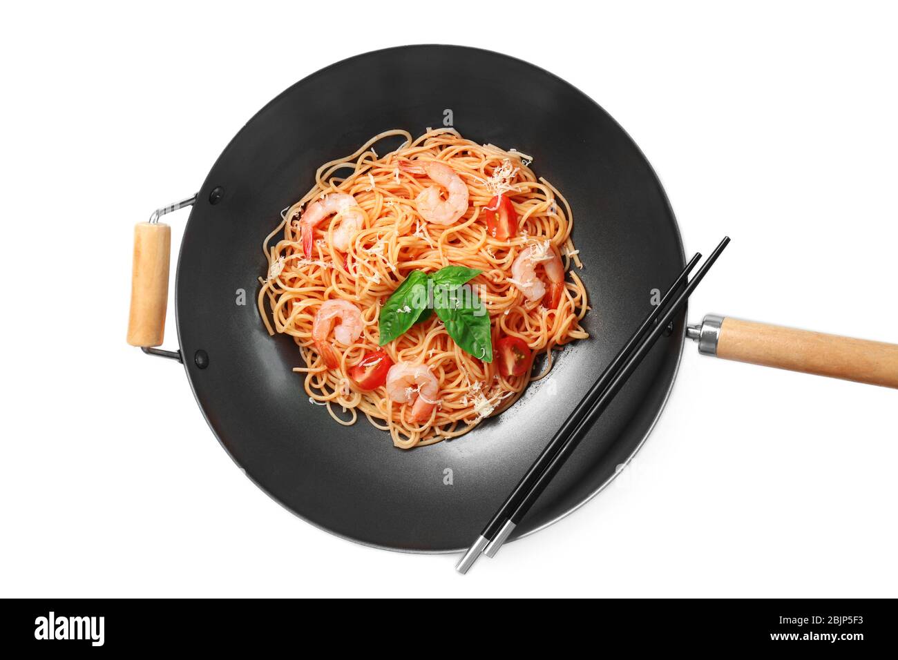 Wok with tasty pasta and shrimps on white background, top view Stock ...