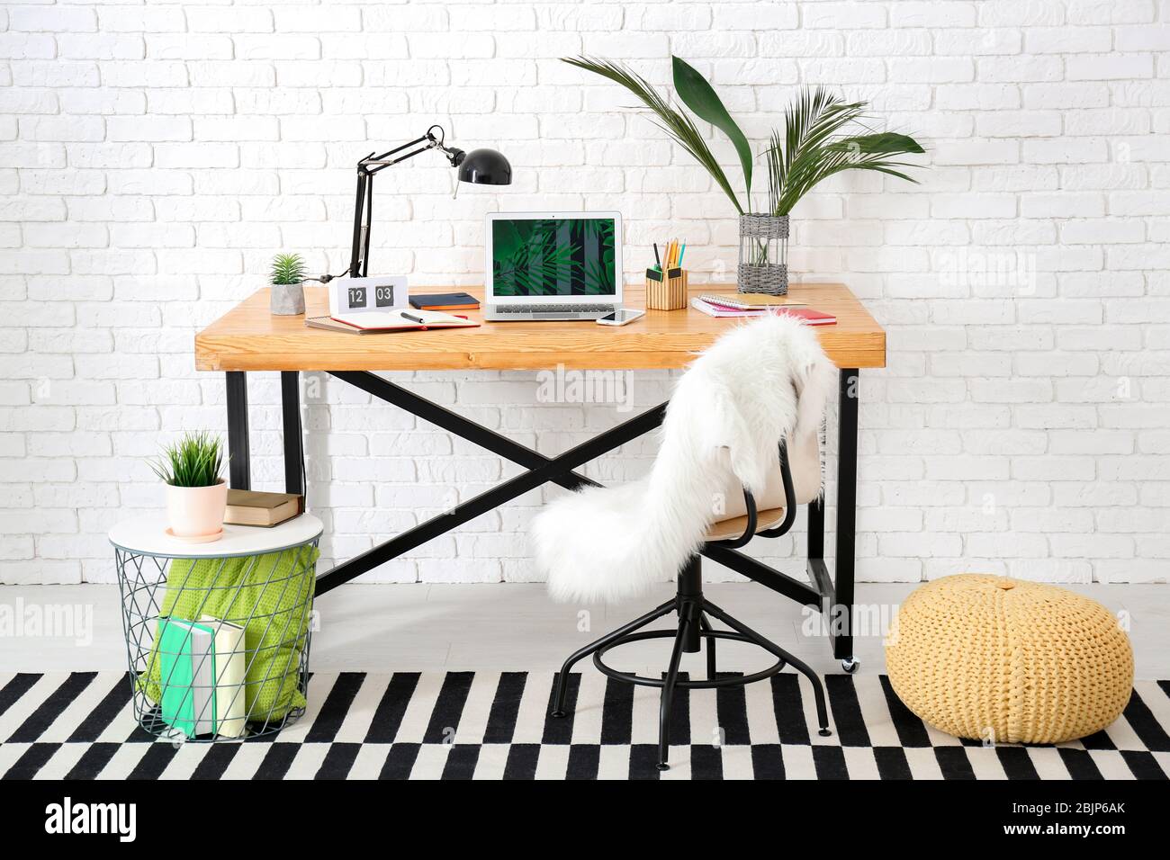 Modern room interior with laptop on table Stock Photo - Alamy