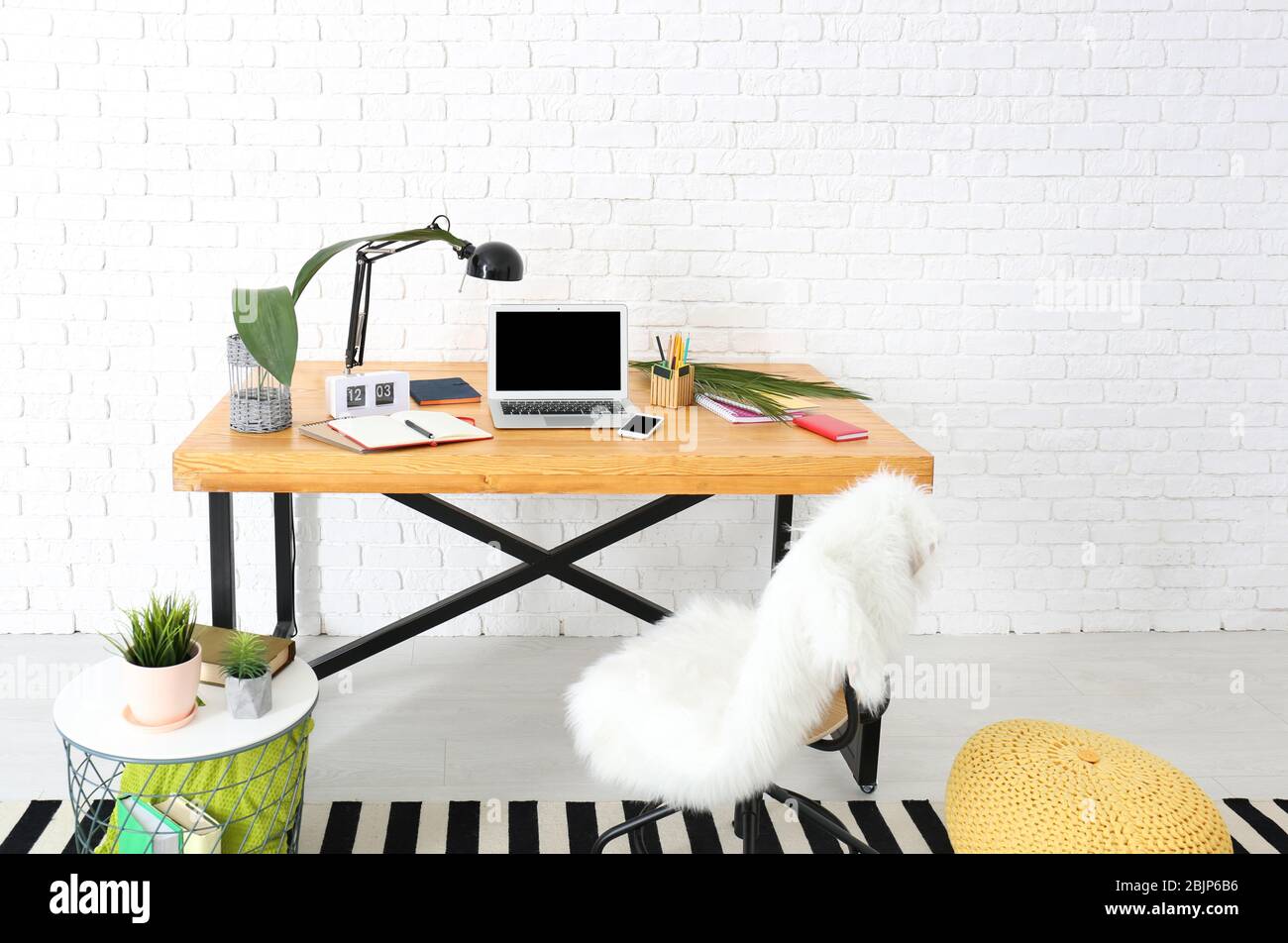 Modern room interior with laptop on table Stock Photo - Alamy