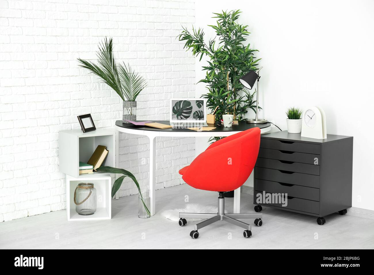 Modern room interior with laptop on table Stock Photo - Alamy