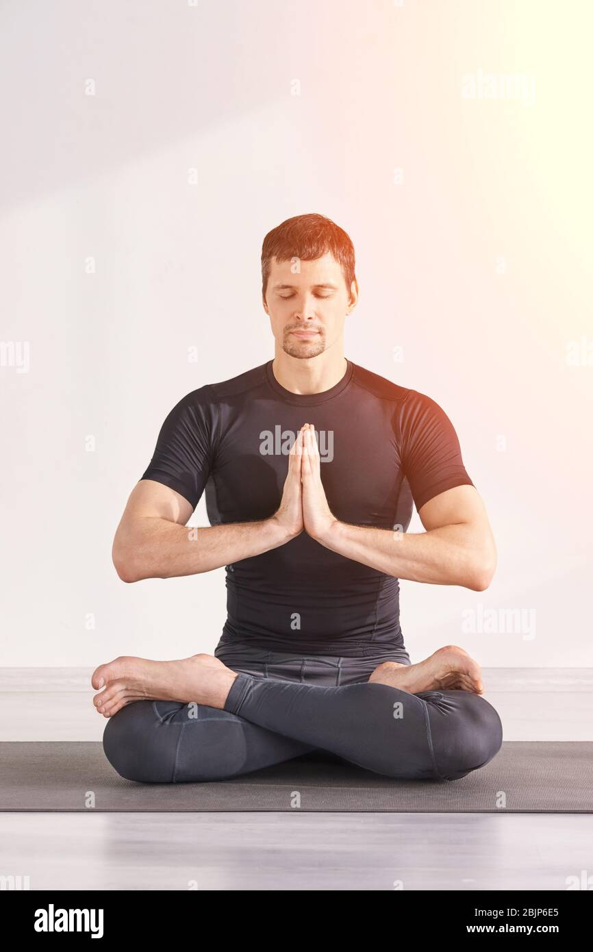 Yoga man hands. Namaste arm position. Gym studio Stock Photo - Alamy