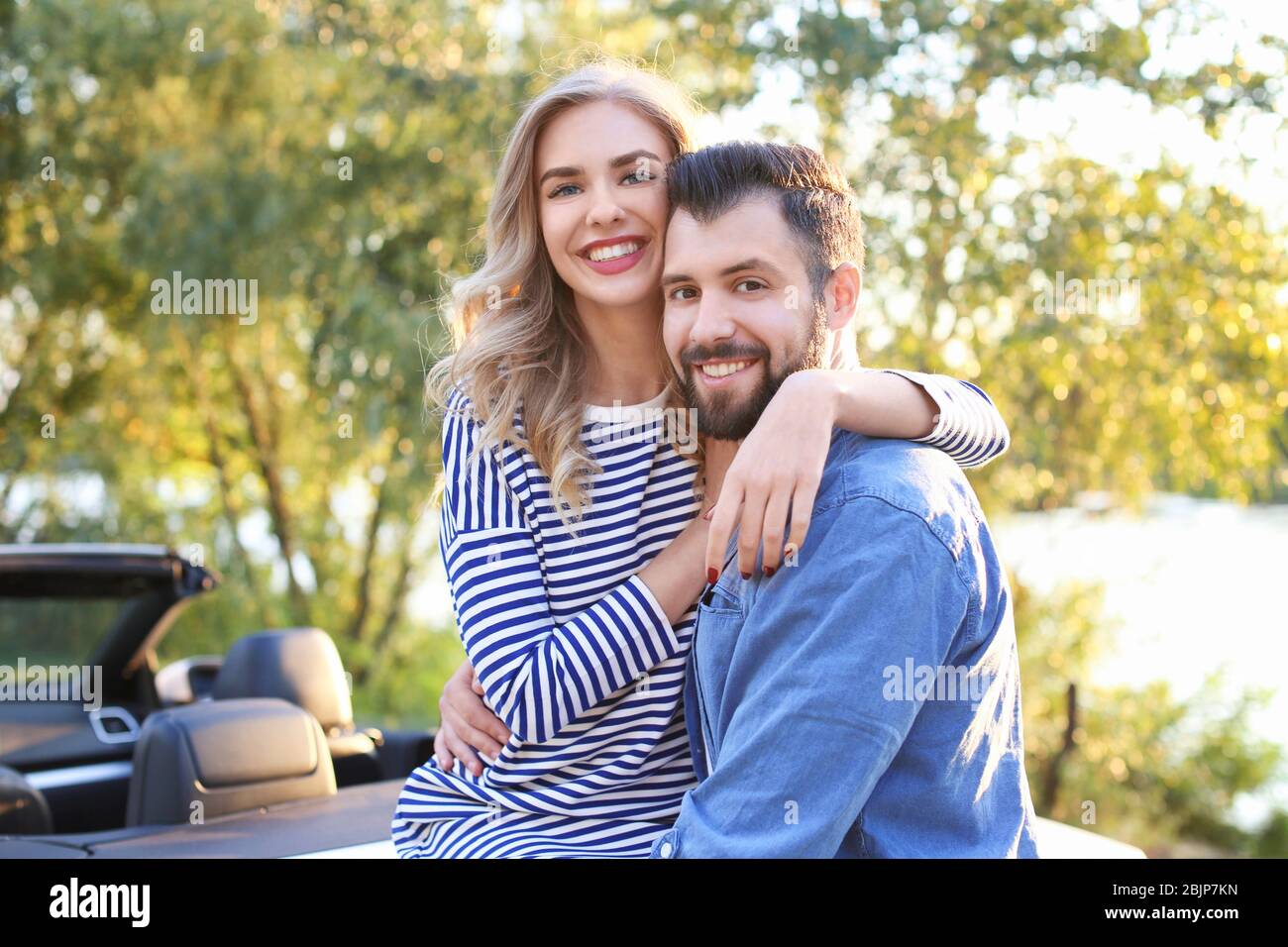 Woman man hugging near car hi-res stock photography and images - Alamy