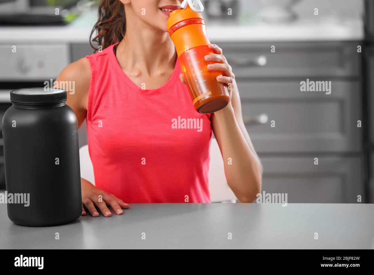 Woman drinking protein shake hi-res stock photography and images - Alamy