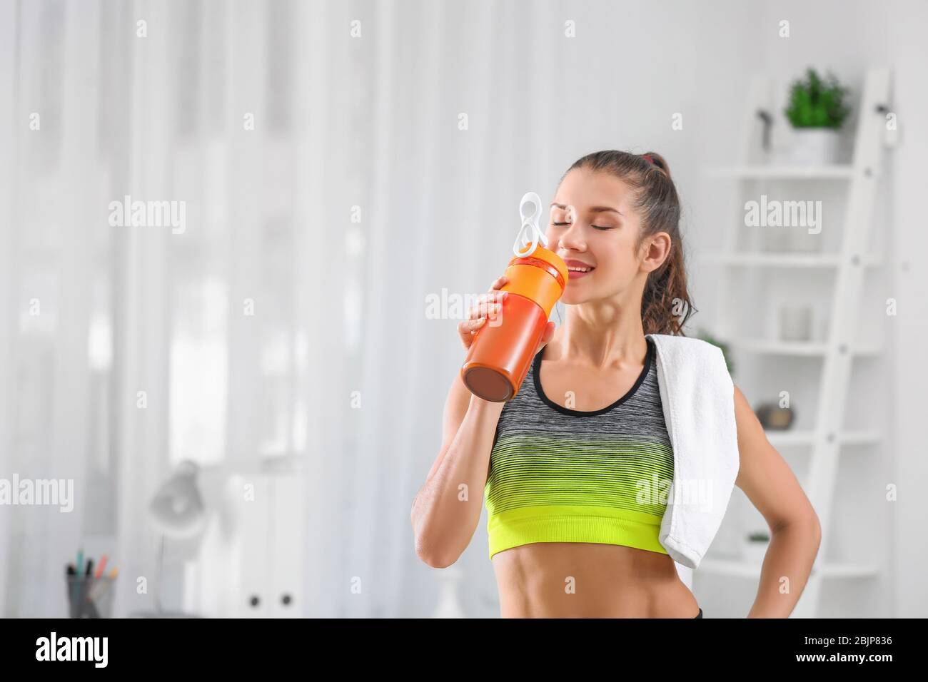 Woman drinking protein shake hi-res stock photography and images - Alamy