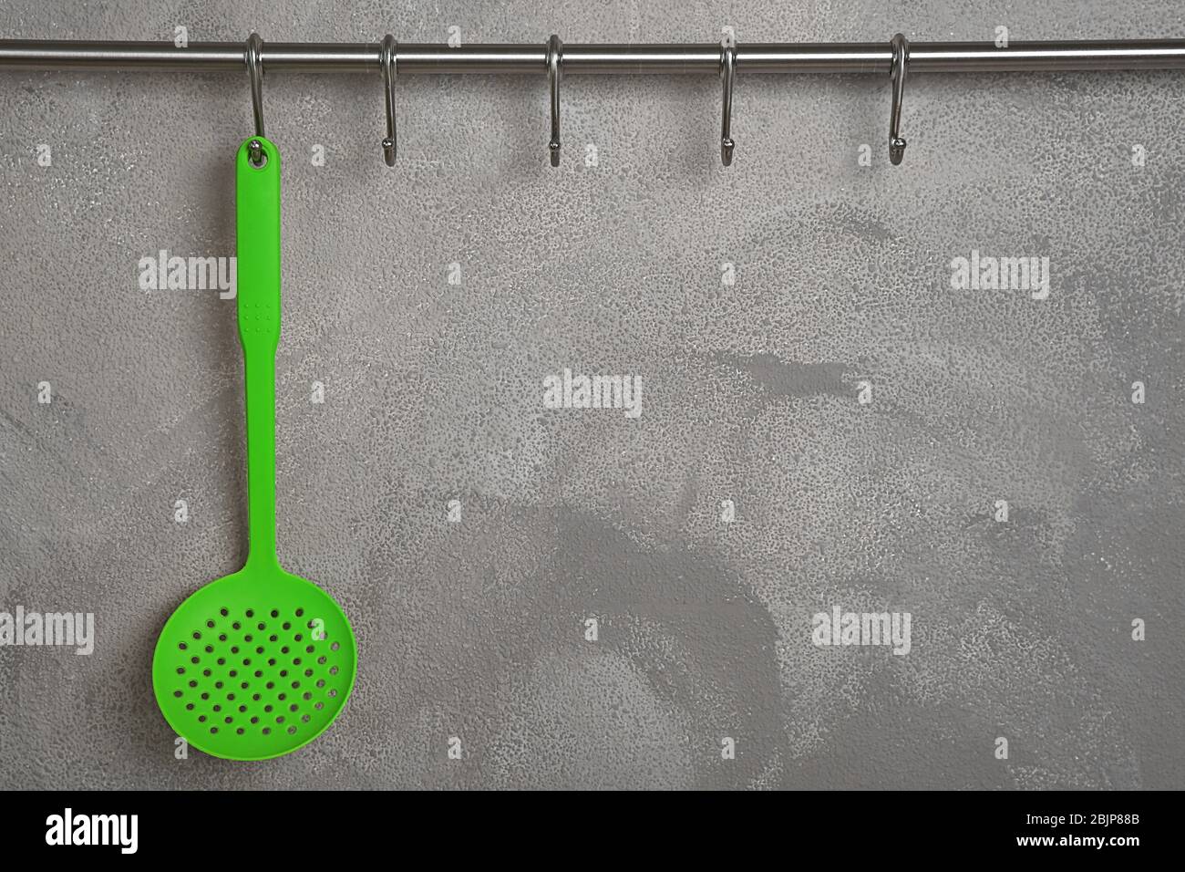 Metal kitchen skimmer plastic hi-res stock photography and images - Alamy