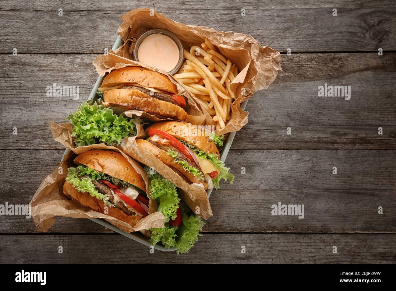 Tasty beef burgers on table Stock Photo - Alamy