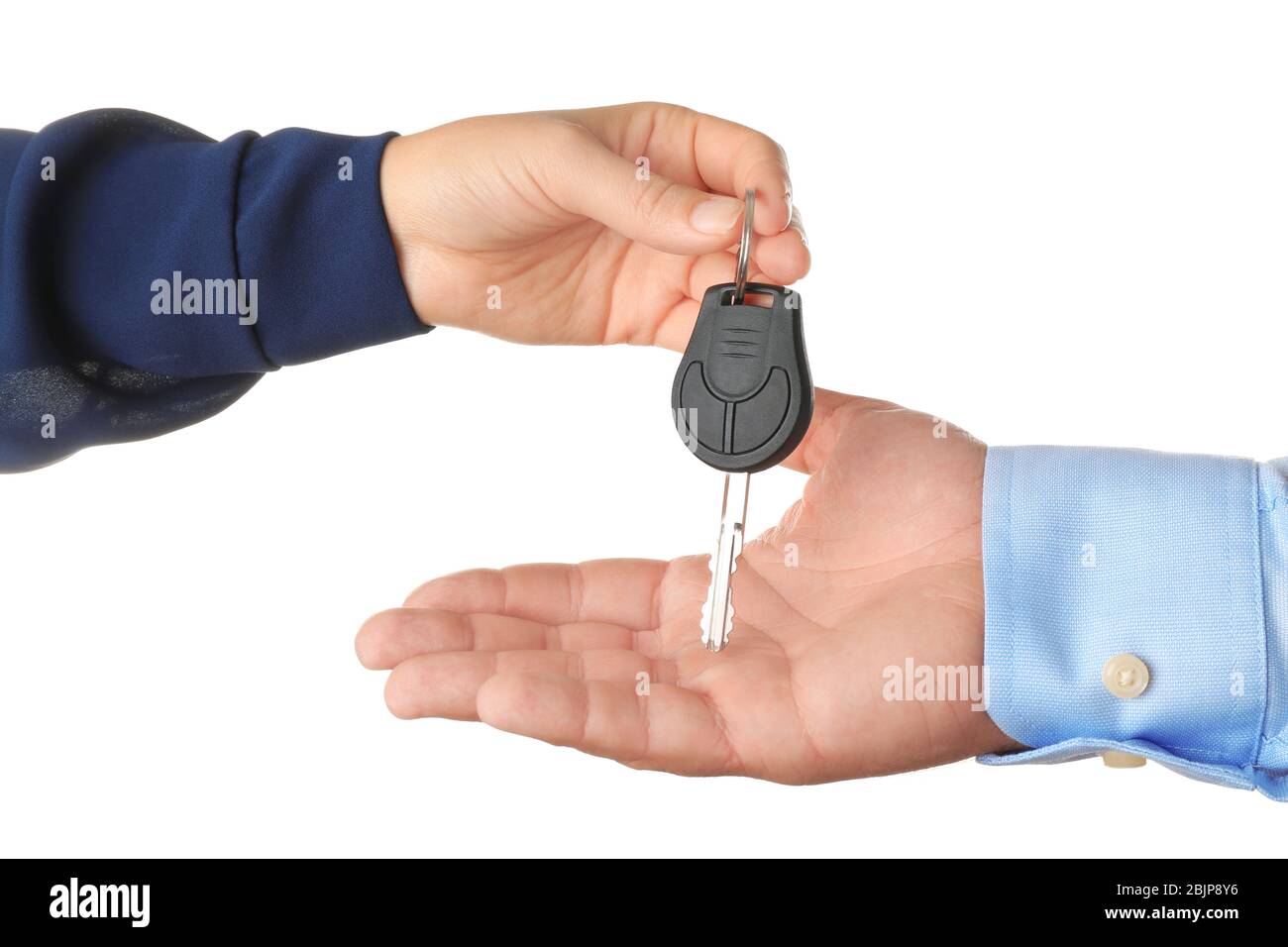 Saleswoman giving car key to customer on white background Stock Photo ...