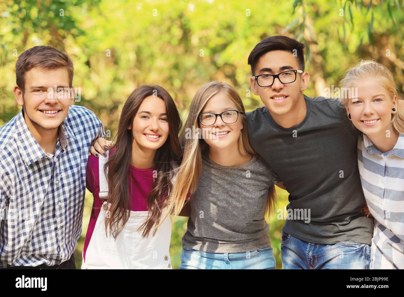 Happy teenagers posing outdoors Stock Photo - Alamy