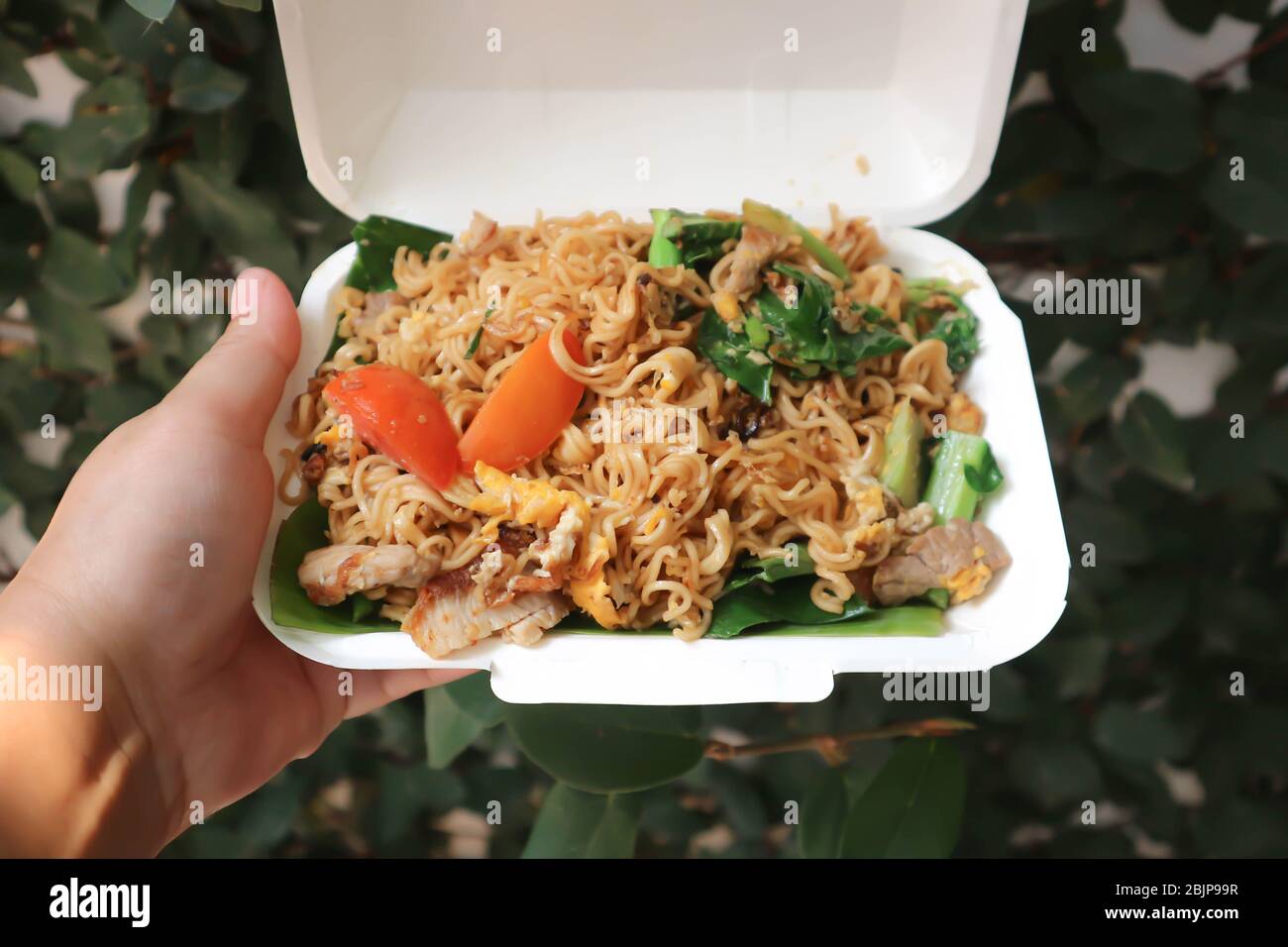 stir fried noodles with pork and vegetable in the box Stock Photo - Alamy