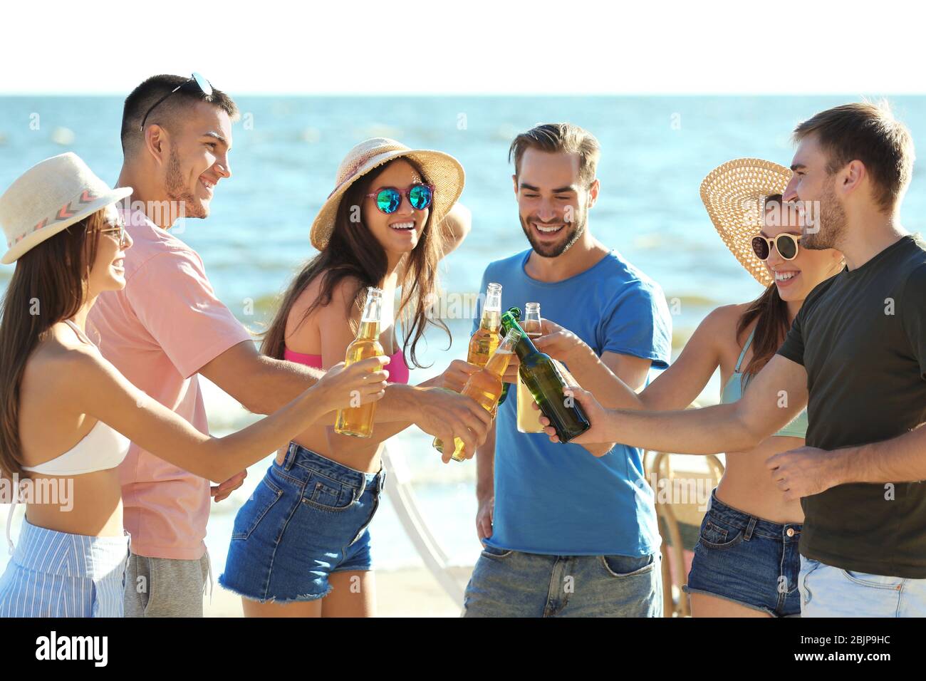 Young people having party on beach Stock Photo - Alamy