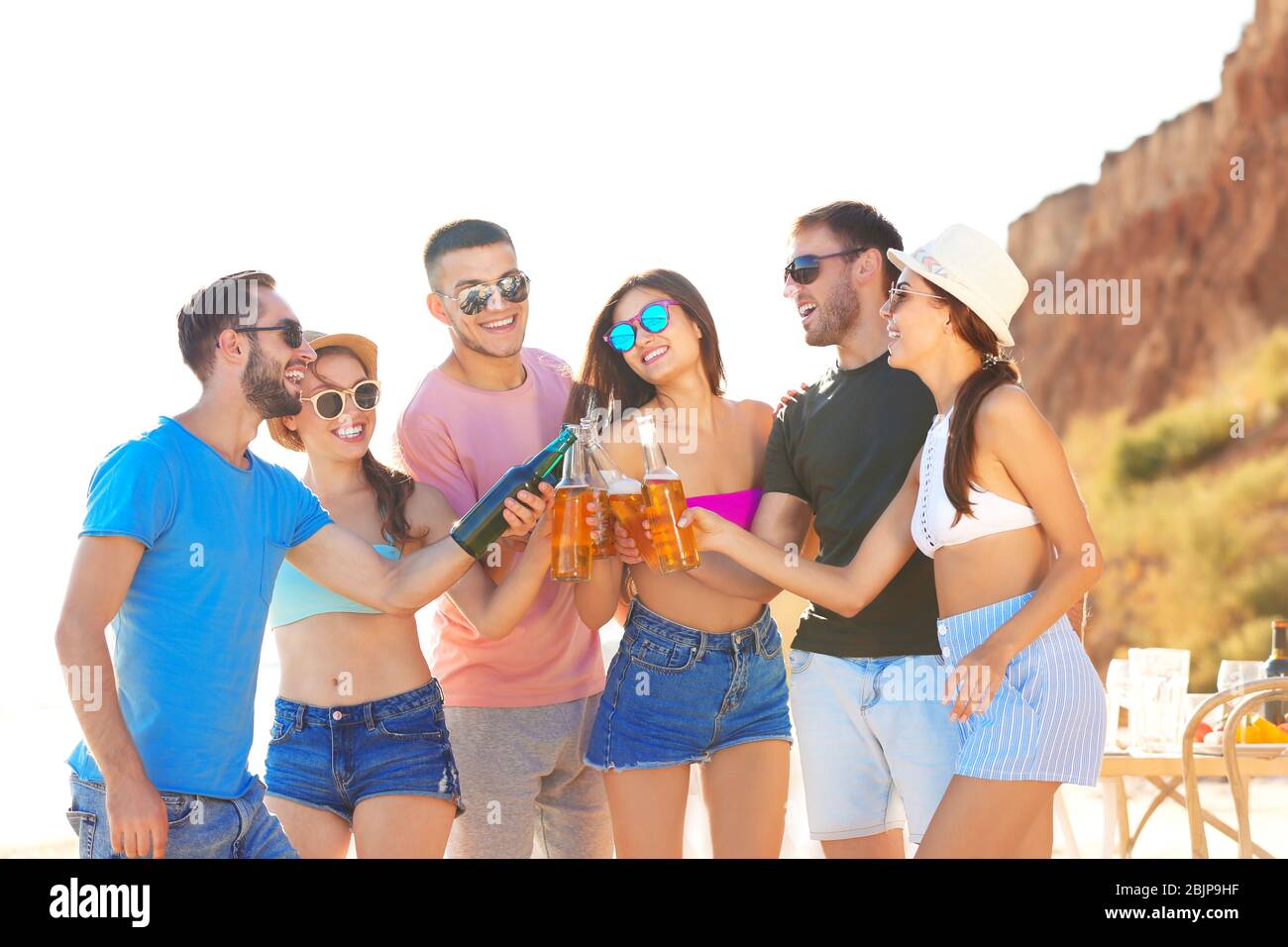 Young people having party on beach Stock Photo - Alamy