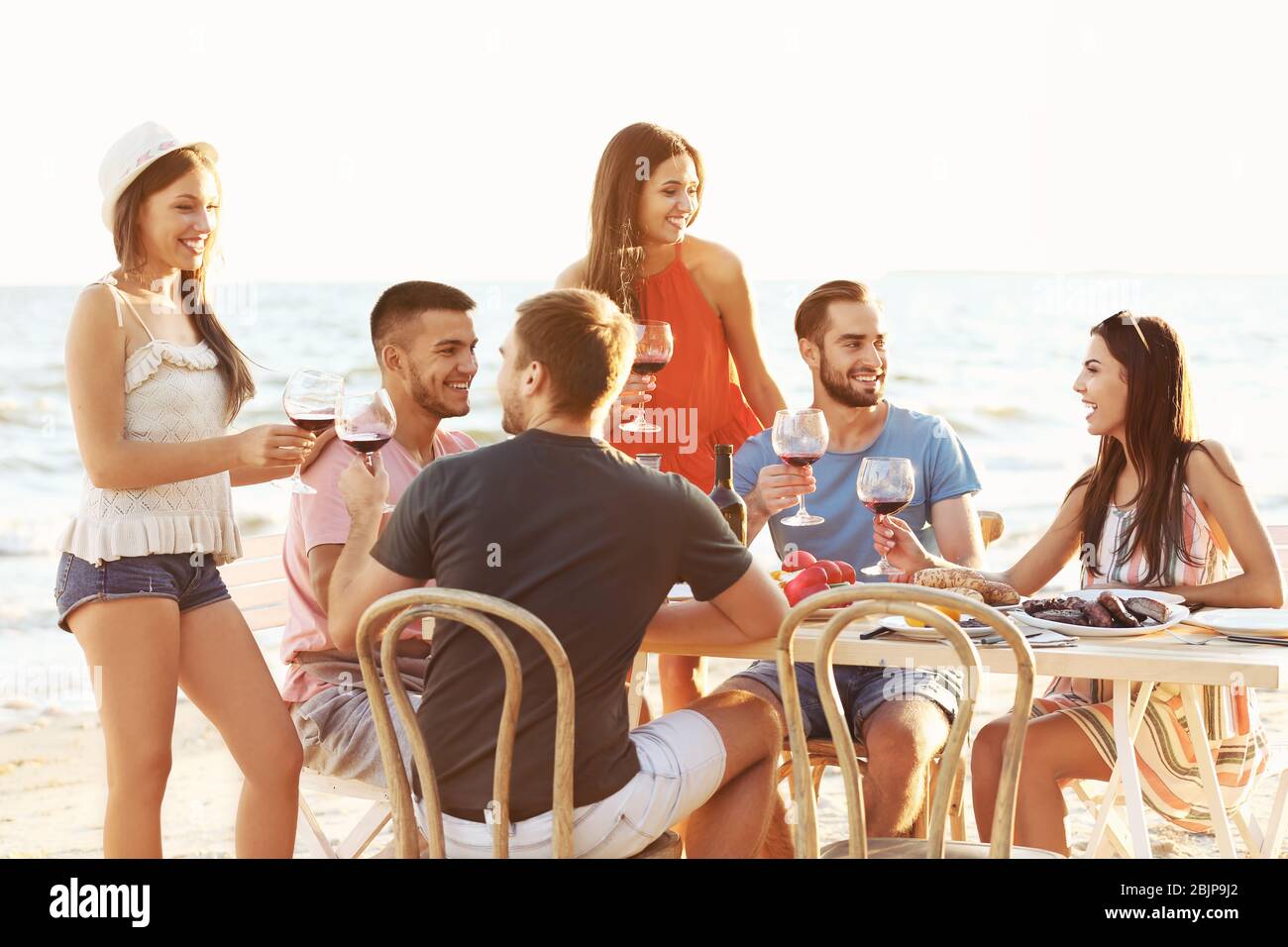 Young people beach barbecue food beach hi-res stock photography and ...
