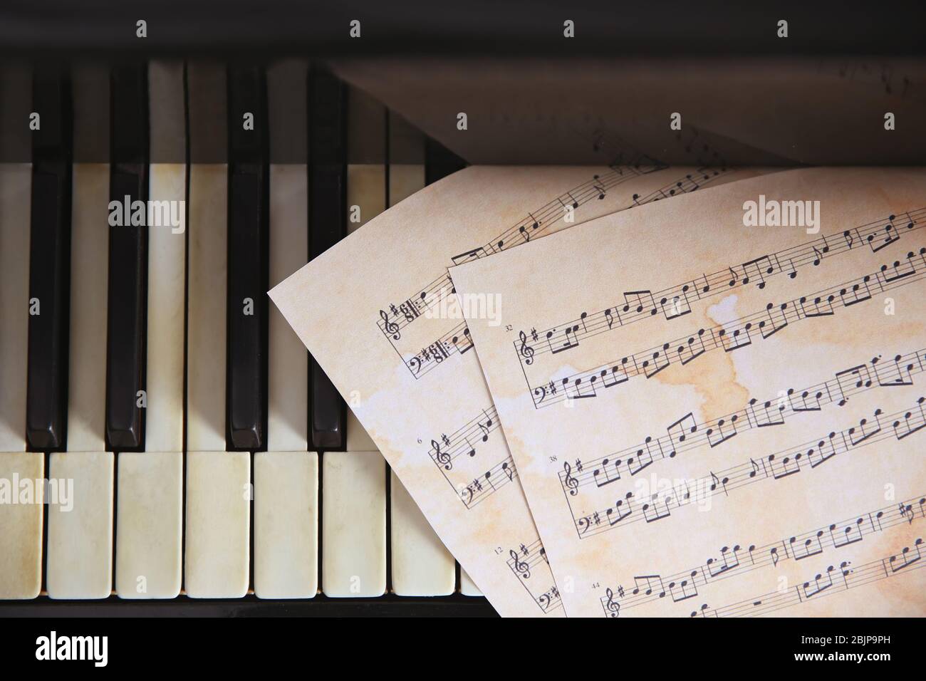 Music sheets on piano, close up Stock Photo - Alamy