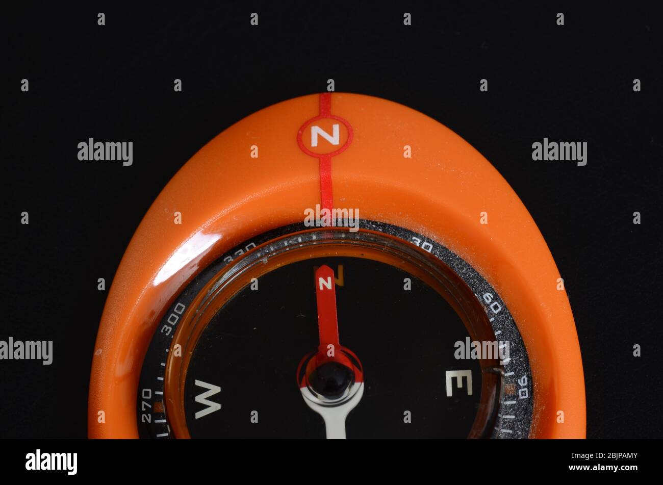 Orange small Compass, close up, north diredction, needle, compass ...