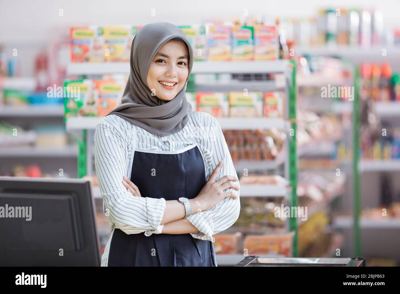 portrait of happy asian female shopkeeper Stock Photo - Alamy