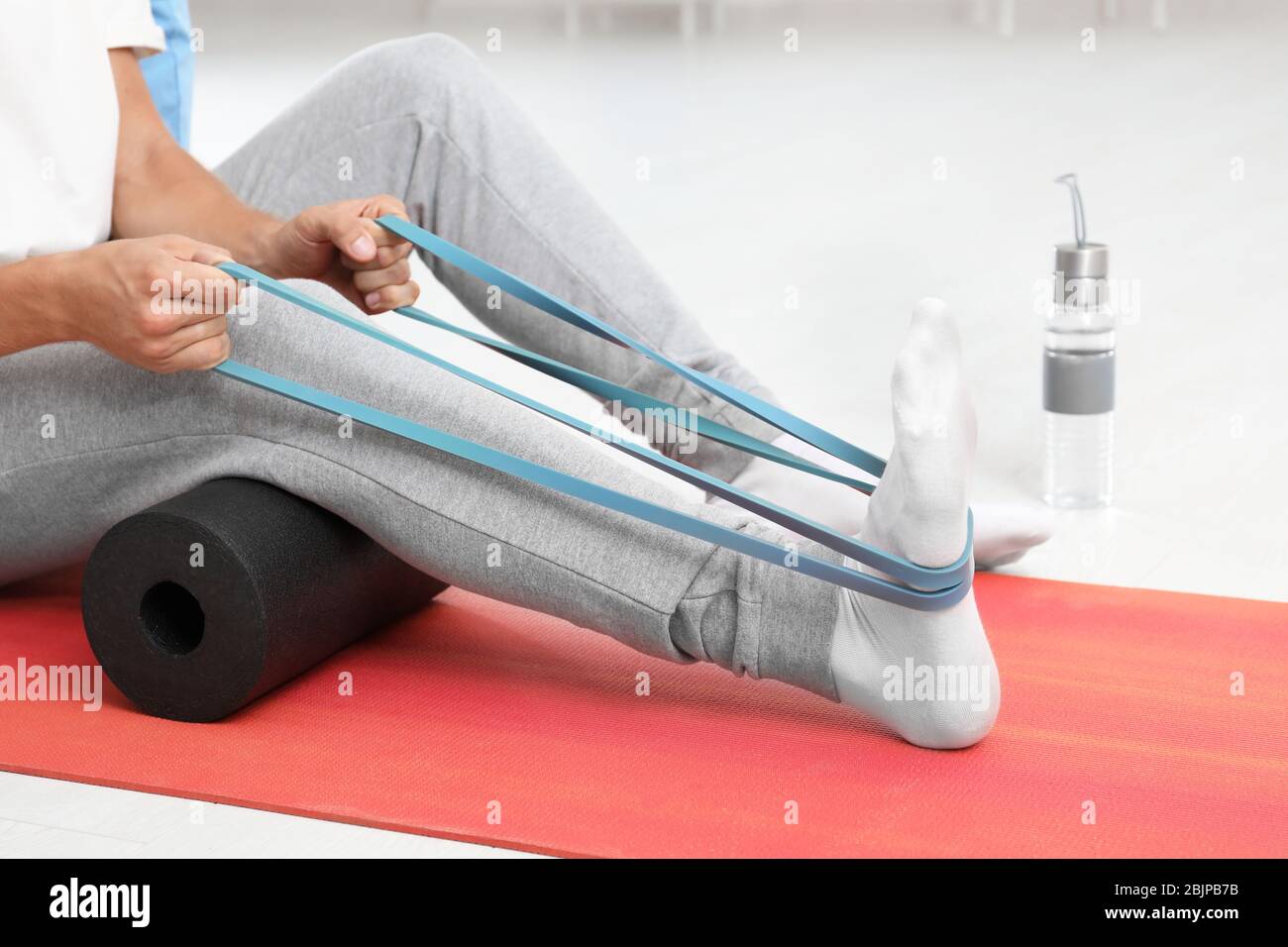Patient doing exercise during physiotherapy session in clinic Stock ...