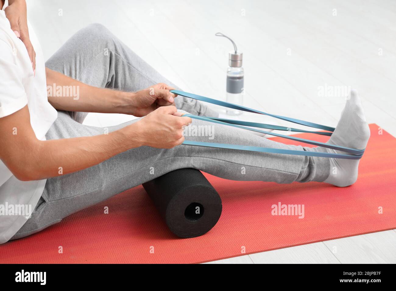 Patient doing exercise during physiotherapy session in clinic Stock ...