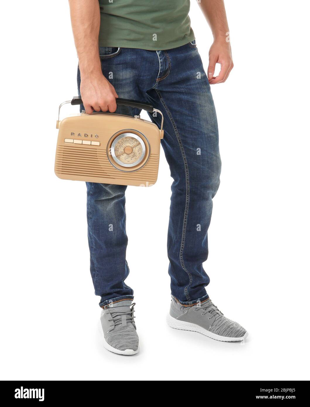 Young man holding retro radio on white background Stock Photo - Alamy