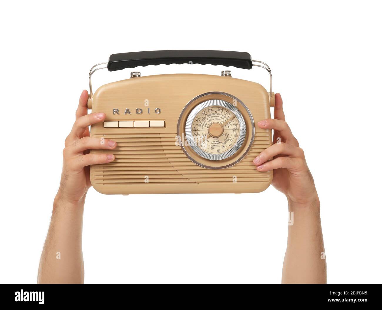 Young man holding retro radio on white background Stock Photo - Alamy