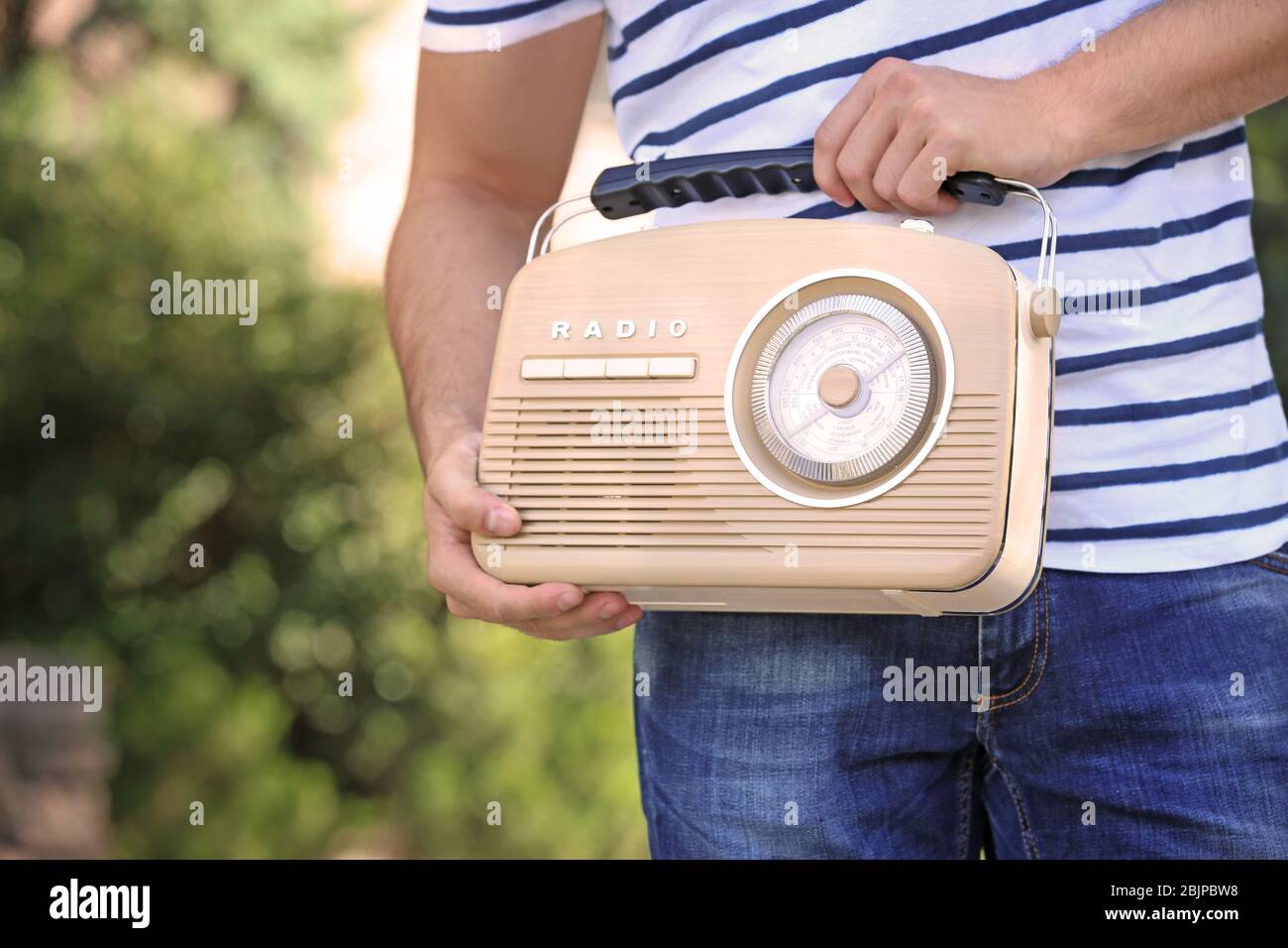 Person listening to transistor radio hi-res stock photography and ...
