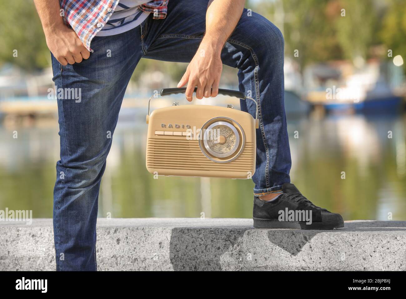 Person listening to transistor radio hi-res stock photography and ...