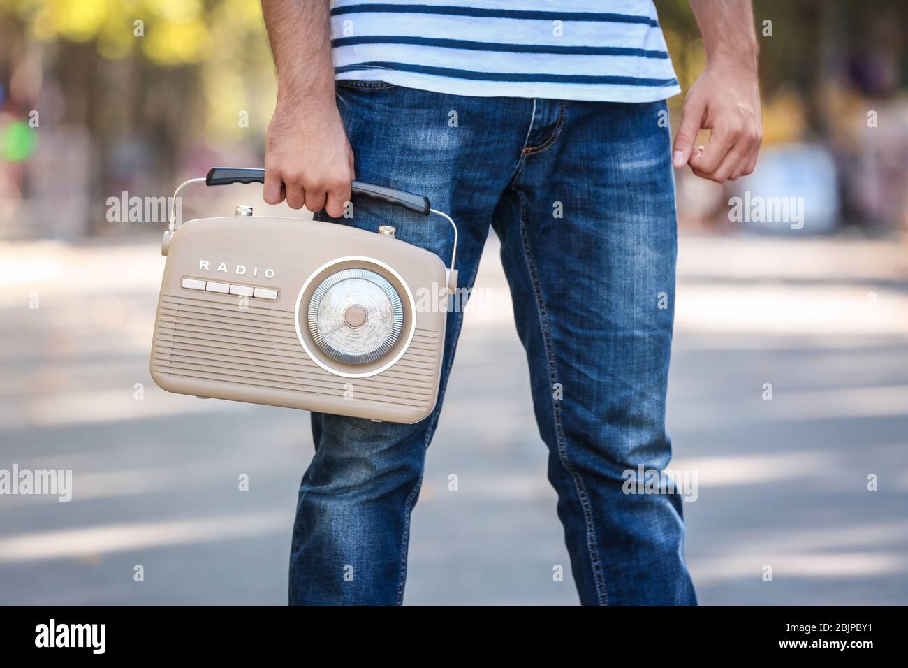 Person listening to transistor radio hi-res stock photography and ...