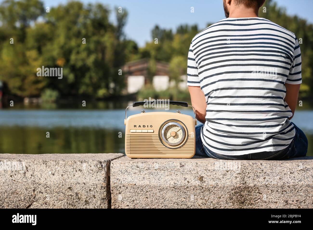 Person listening to transistor radio hi-res stock photography and ...