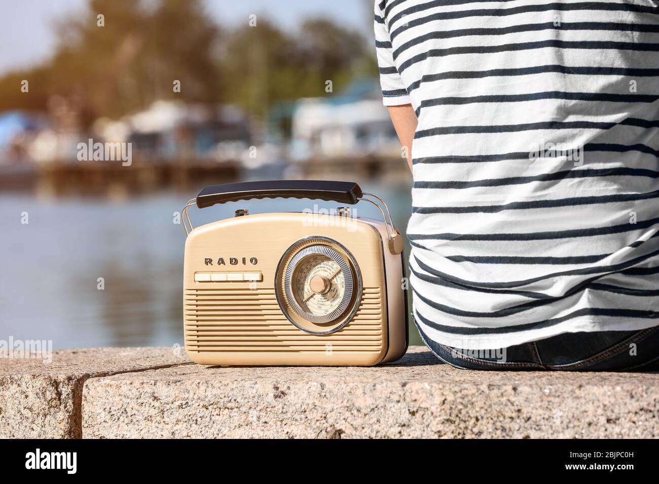 Person listening to transistor radio hi-res stock photography and ...