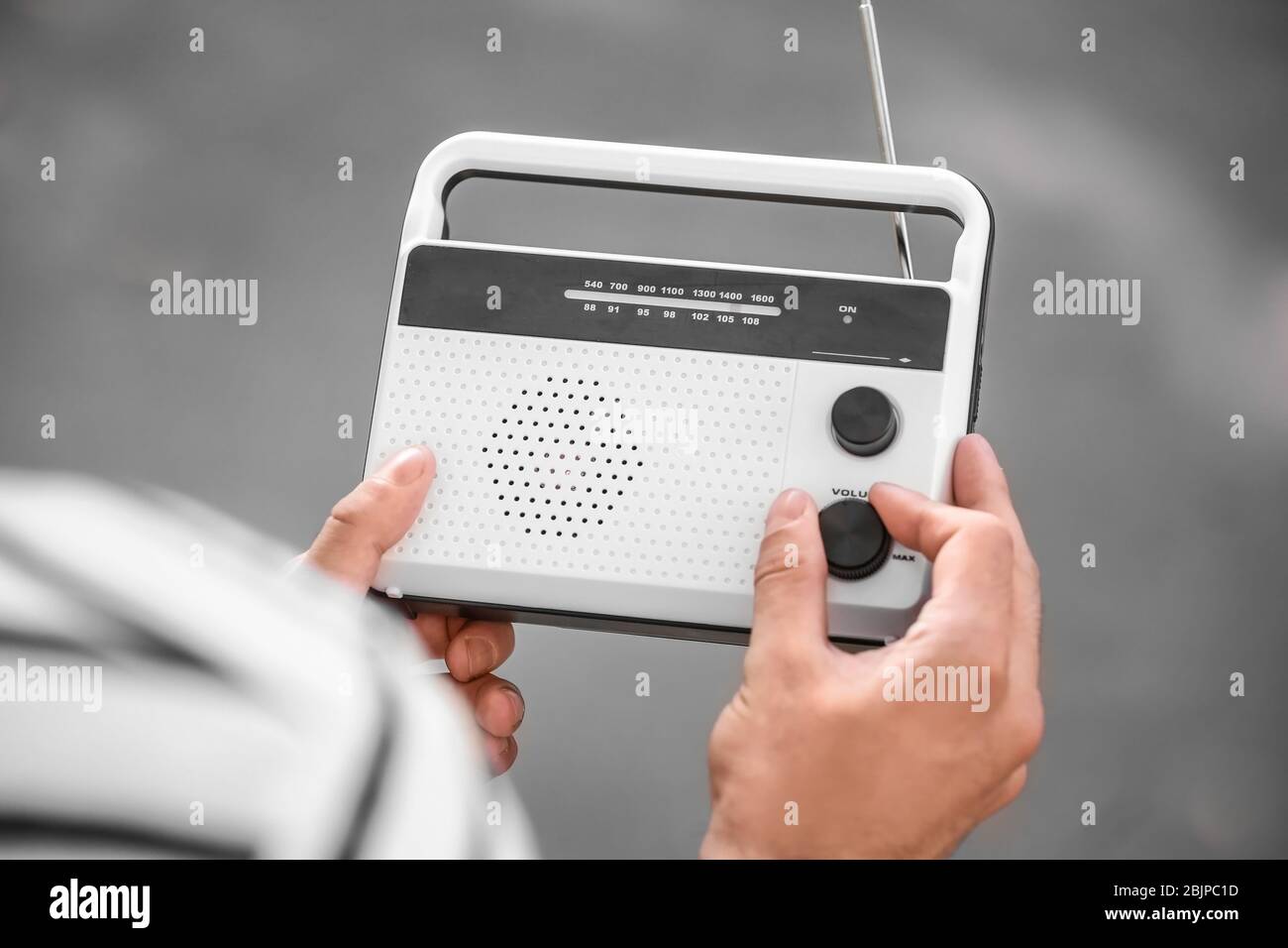Person listening to transistor radio hi-res stock photography and ...