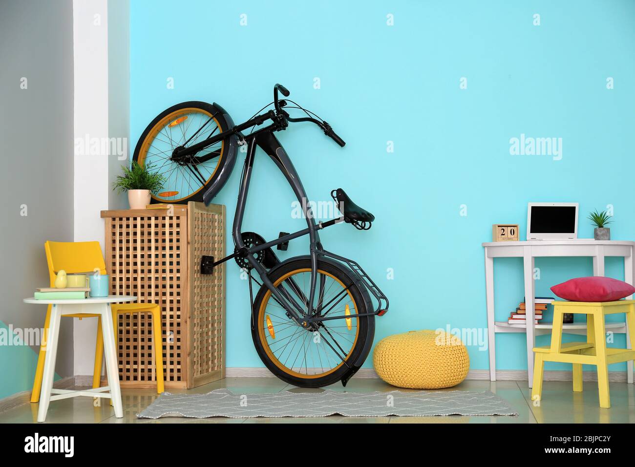 Modern bicycle in cozy room interior Stock Photo - Alamy