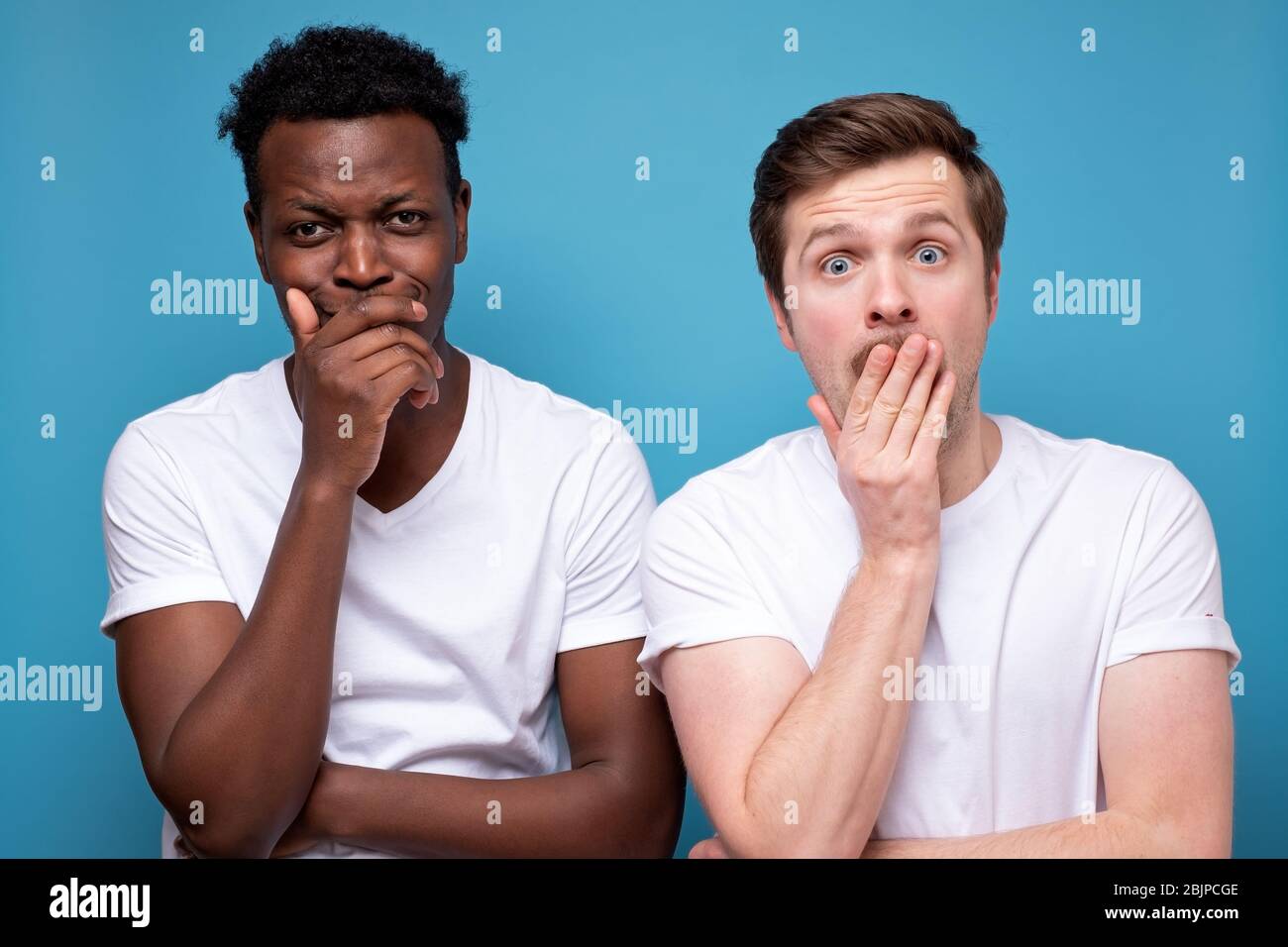 Two shocked men look with amazement at camera, cant believe in failure ...