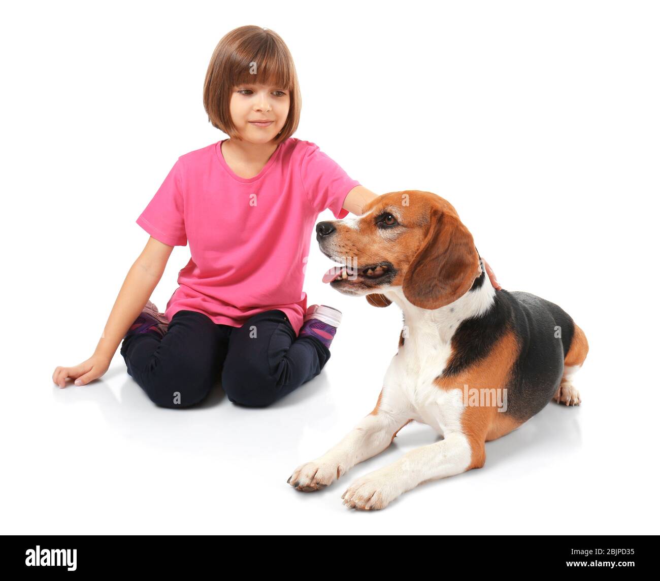 Cute little girl with dog on white background Stock Photo - Alamy