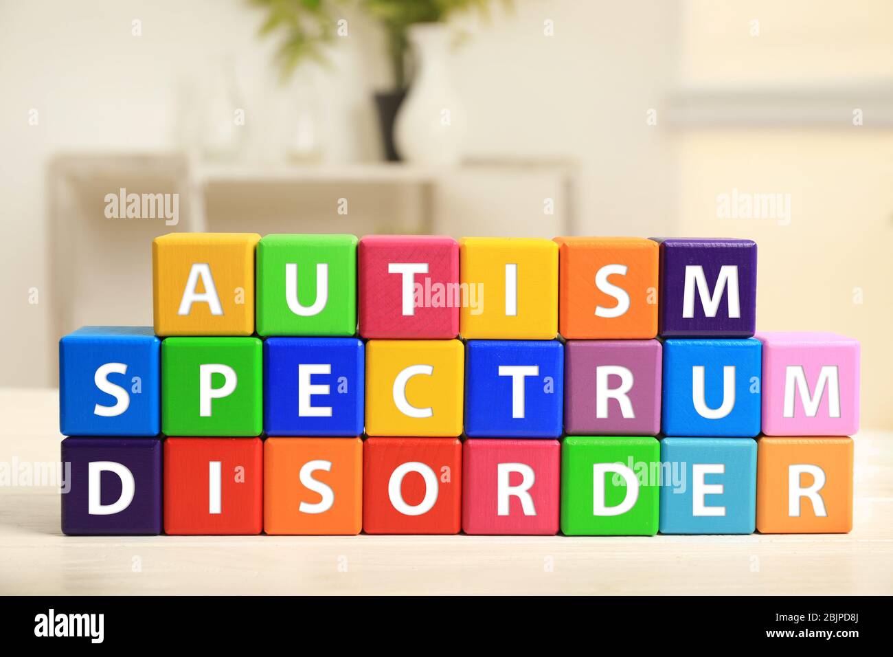 Cubes with text AUTISM SPECTRUM DISORDER on table Stock Photo - Alamy