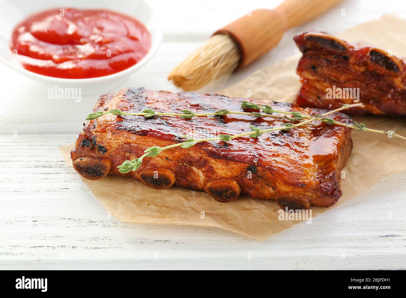 Delicious grilled ribs on table Stock Photo - Alamy
