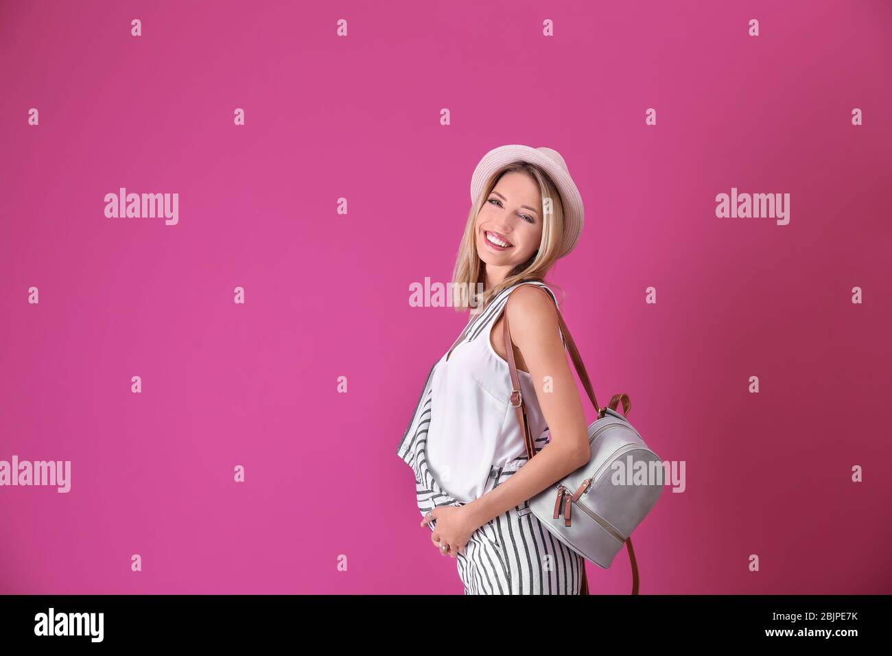 Beautiful pregnant woman on pink background Stock Photo - Alamy