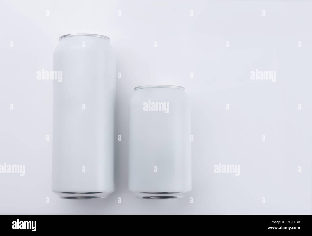 Two tin cans, isolated on white Stock Photo - Alamy